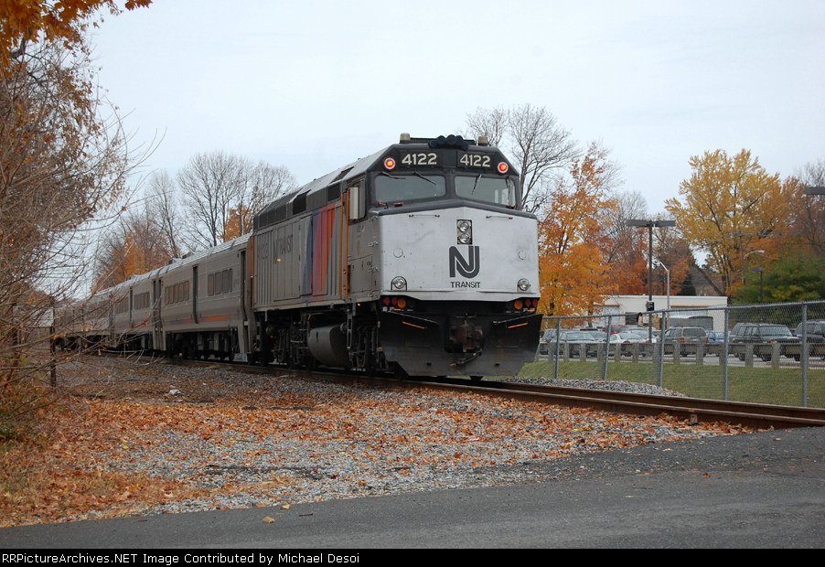 NJT 4122 sits at the passenger station with fall in full bloom